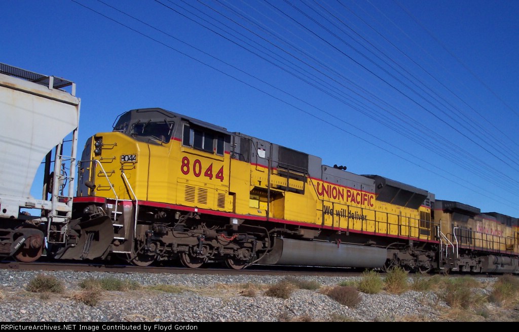 UP 8044 takes to siding as part of seven unit grain train